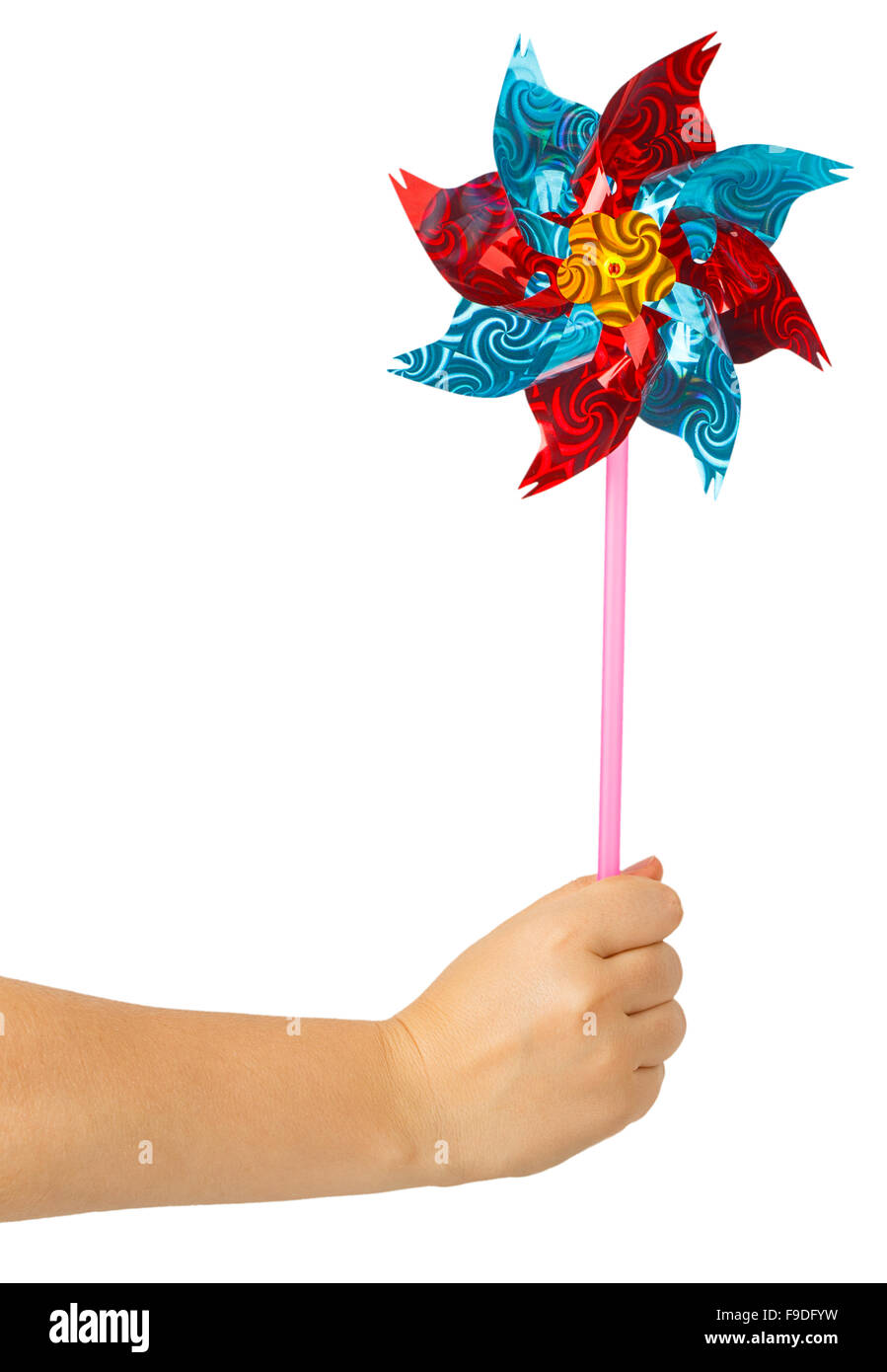 Colorful children's pinwheel in female hand isolated on white ...