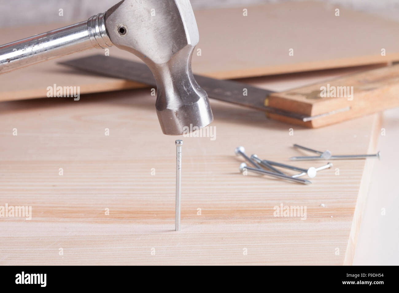 Hammer driving nail hi-res stock photography and images - Alamy