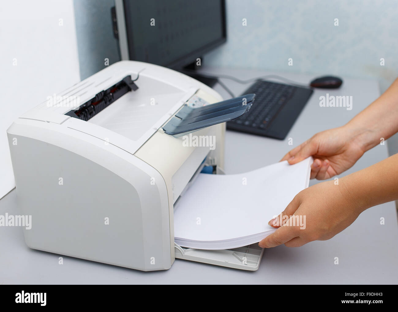 Woman's hand with working copier Stock Photo - Alamy