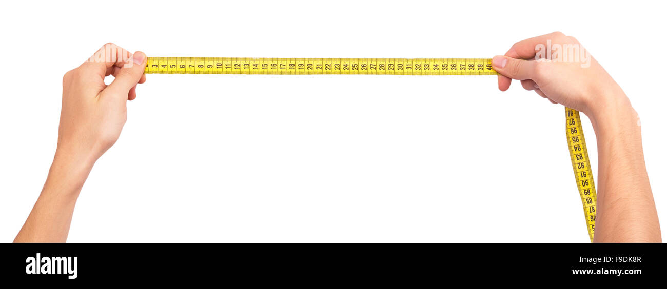 Human hand stretching a measure tape on a white isolated background ...