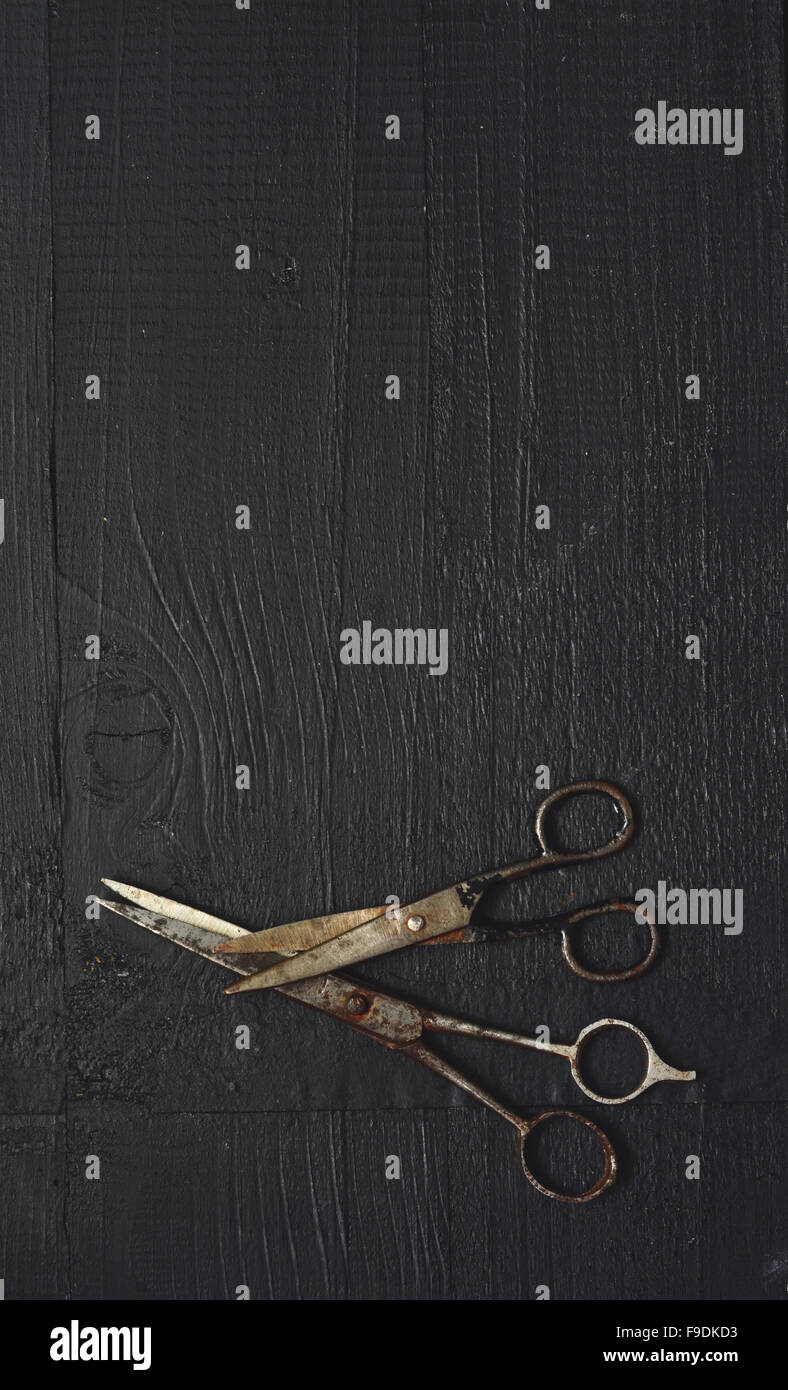 Old rusty scissors on wooden table with copy space Stock Photo - Alamy