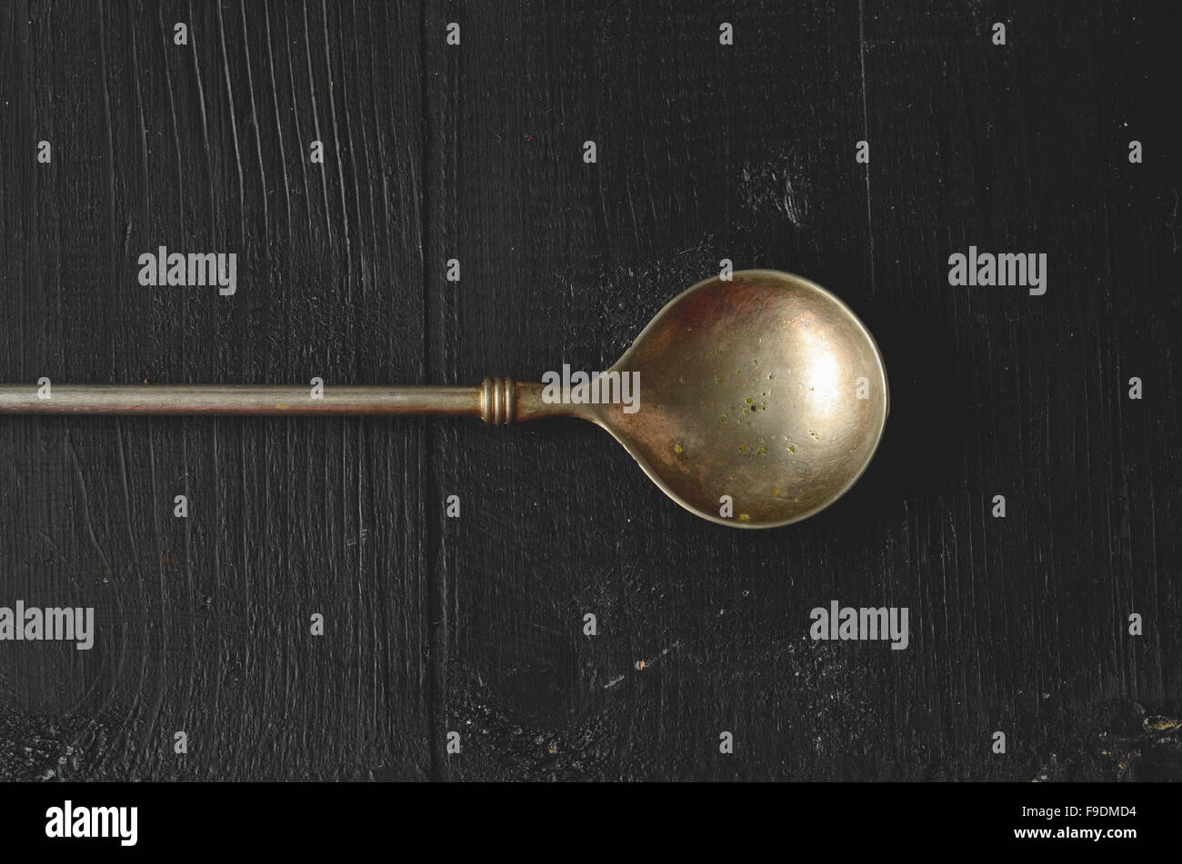 Old metal spoon on dark background with copy space Stock Photo - Alamy