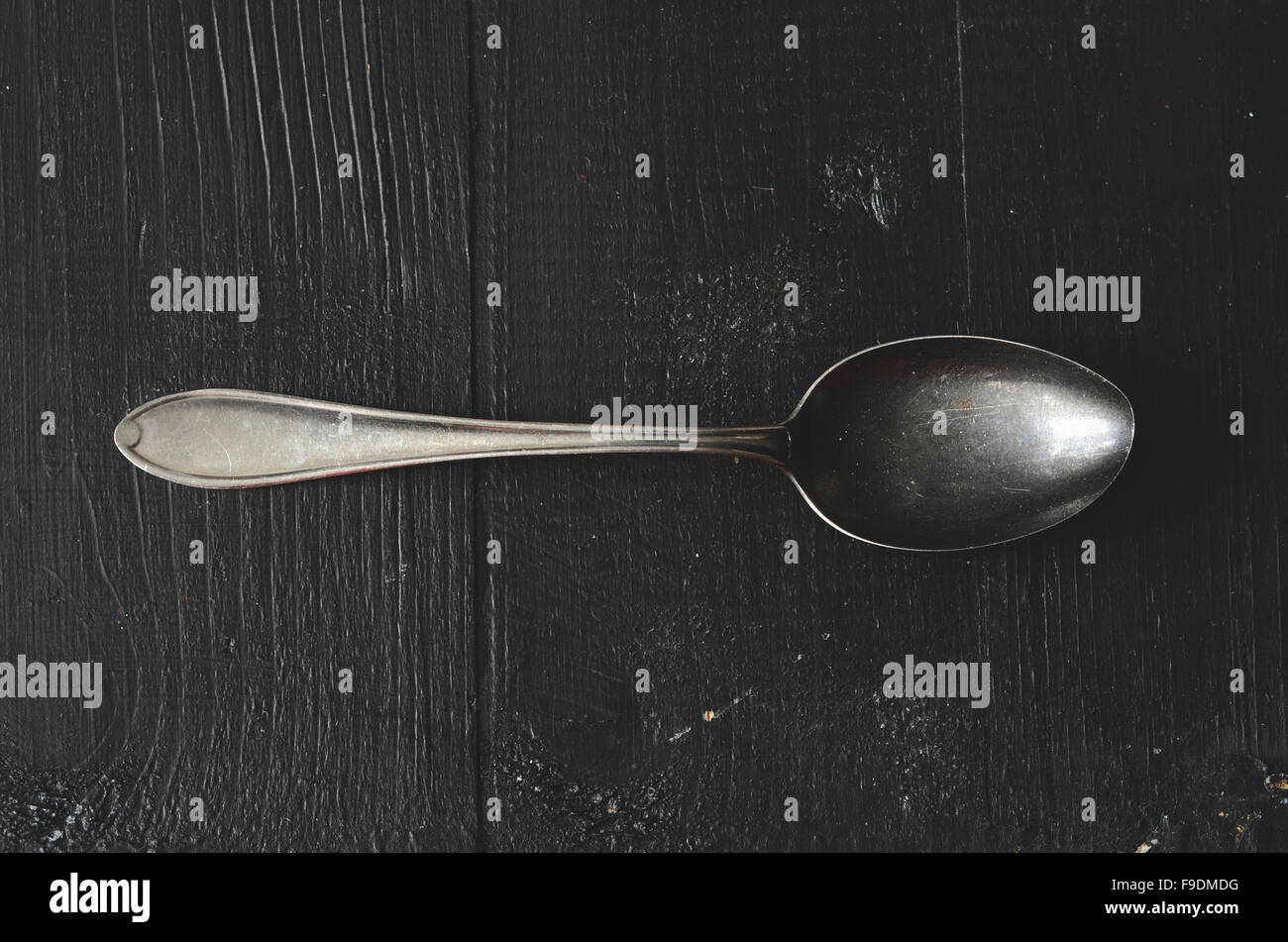 Old metal spoon on dark background with copy space Stock Photo - Alamy