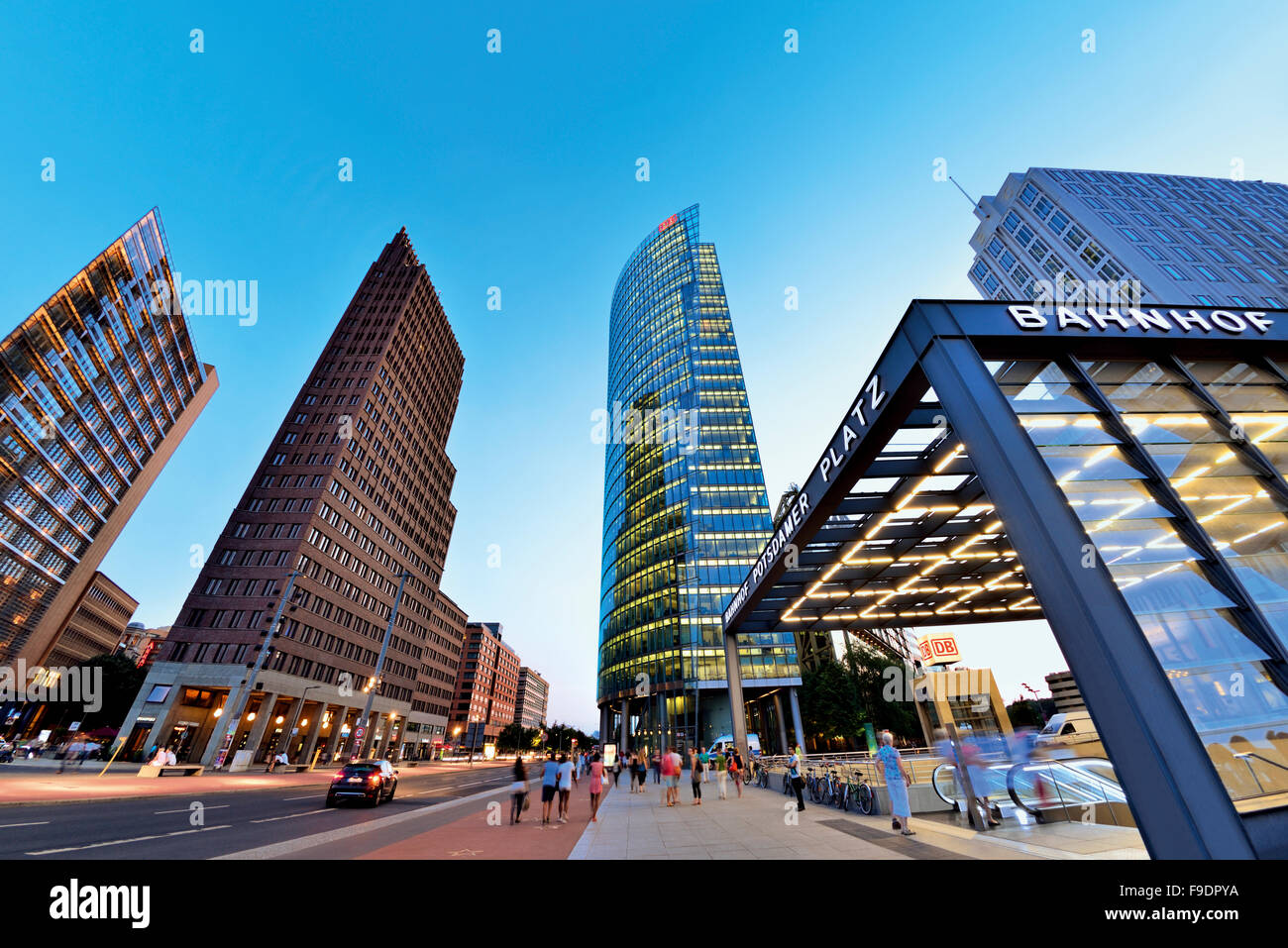 Germany, Berlin: People walking surrounded by high rise glass towers at ...