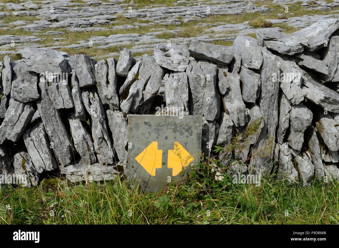 Footpath sign on a limestone dry stone wall abbey Hill Burren County ...