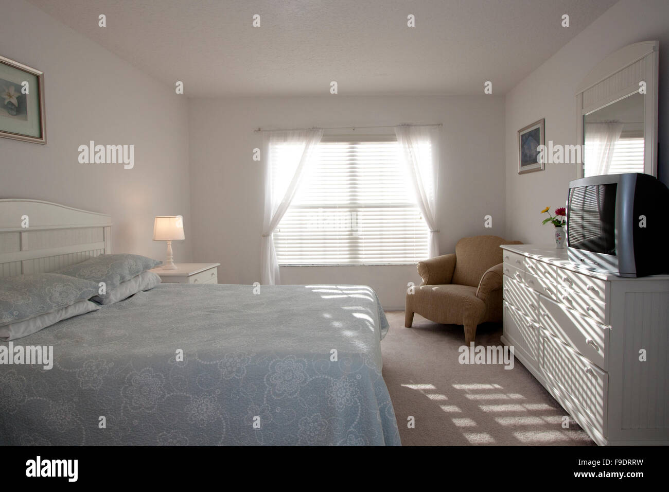 A bedroom with light and shadow Stock Photo - Alamy