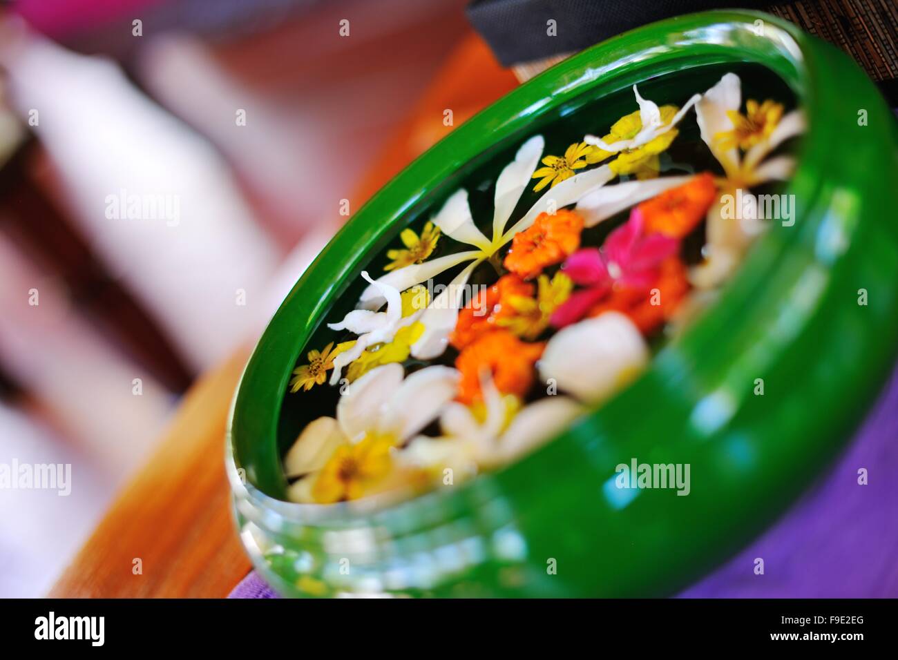 water cup with beautiful flowers, a variety of background colors in spa ...