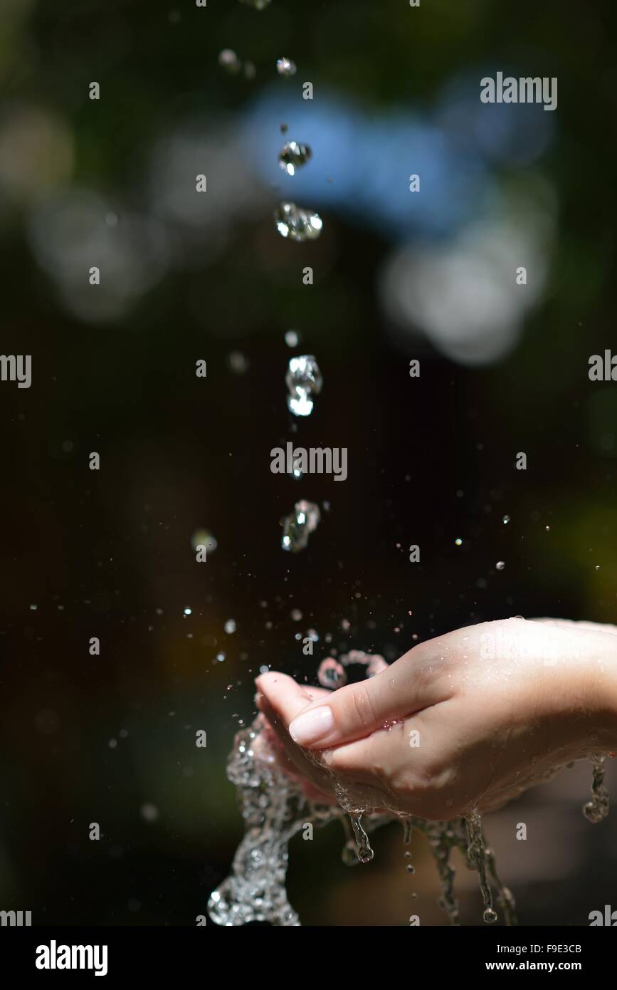 Hand holding clean splash waterfall hi-res stock photography and images ...