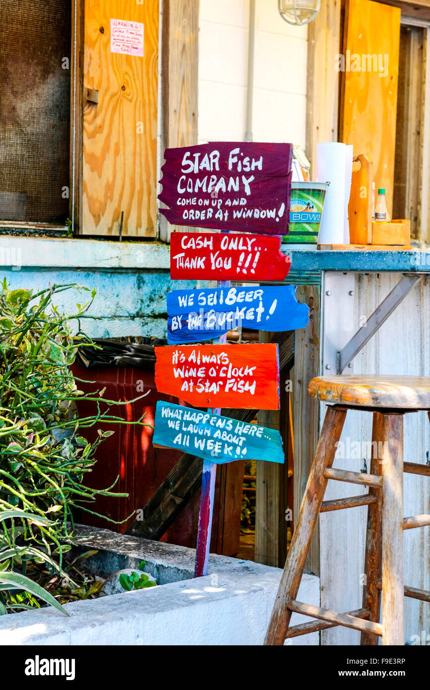 Multiple signs hand painted with proverbs outside a restaurant in ...