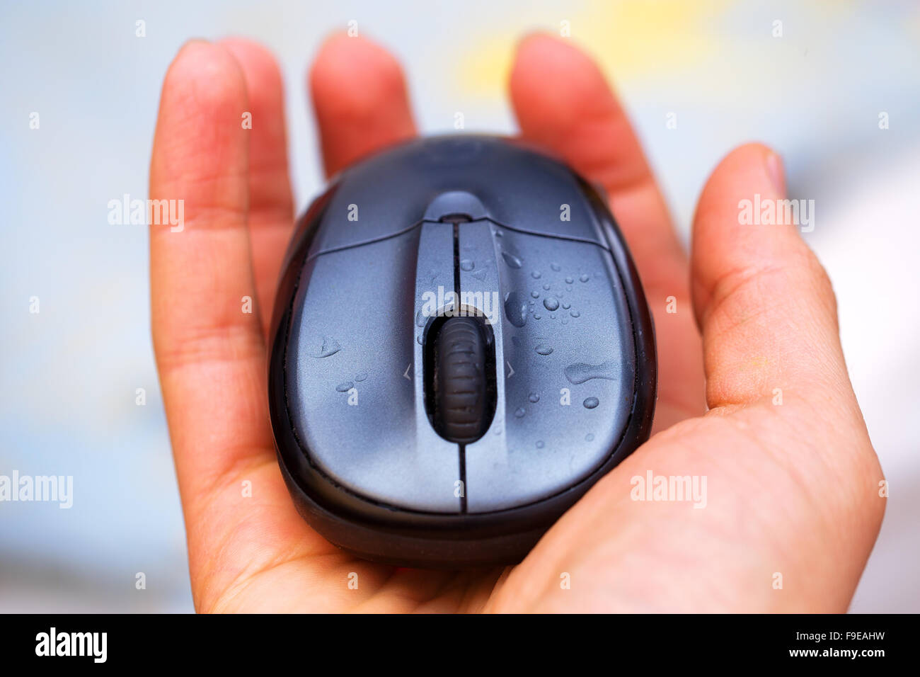 Open Hand and computer mouse with water drops Stock Photo - Alamy