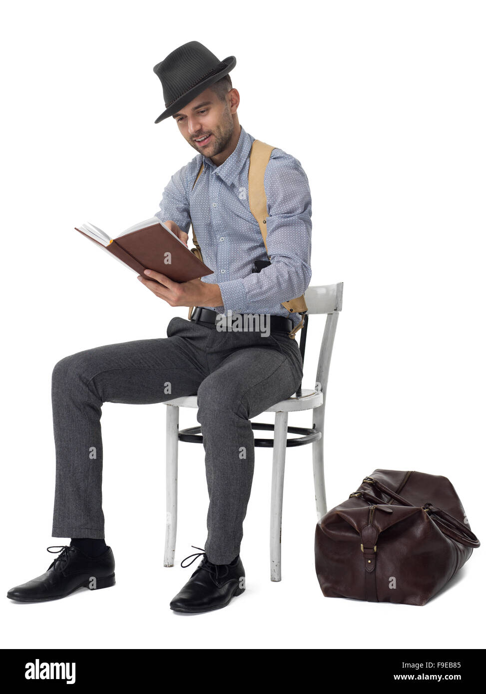 Businessman reading how to rob a bank portrait isolated on white ...