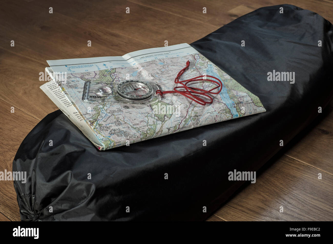 Map, compass and tent Stock Photo - Alamy