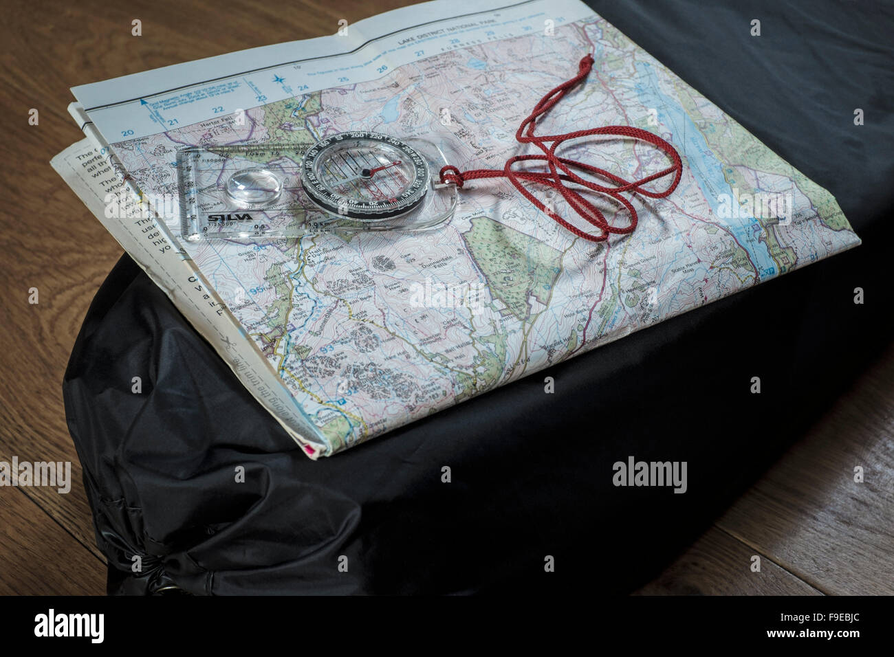 Map, compass and tent Stock Photo - Alamy