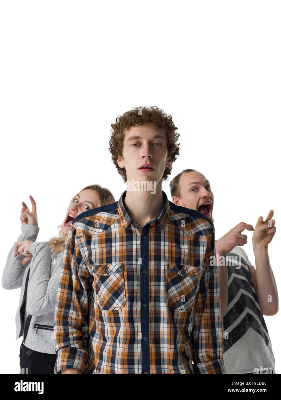 Portrait of young guy with his crazy friends behind him. Isolated on ...