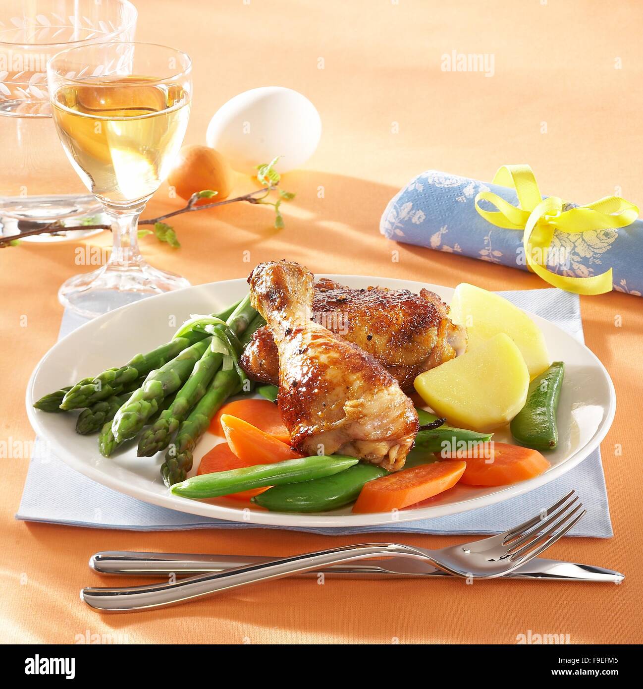 Chicken Legs in Honey and Spring Vegetable Stock Photo - Alamy
