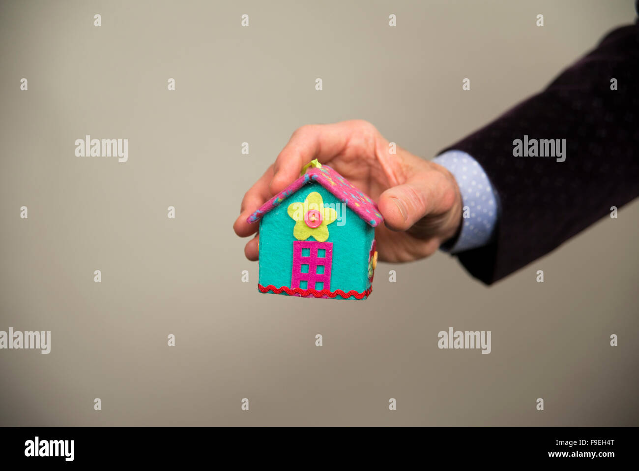 Man with model house Stock Photo - Alamy