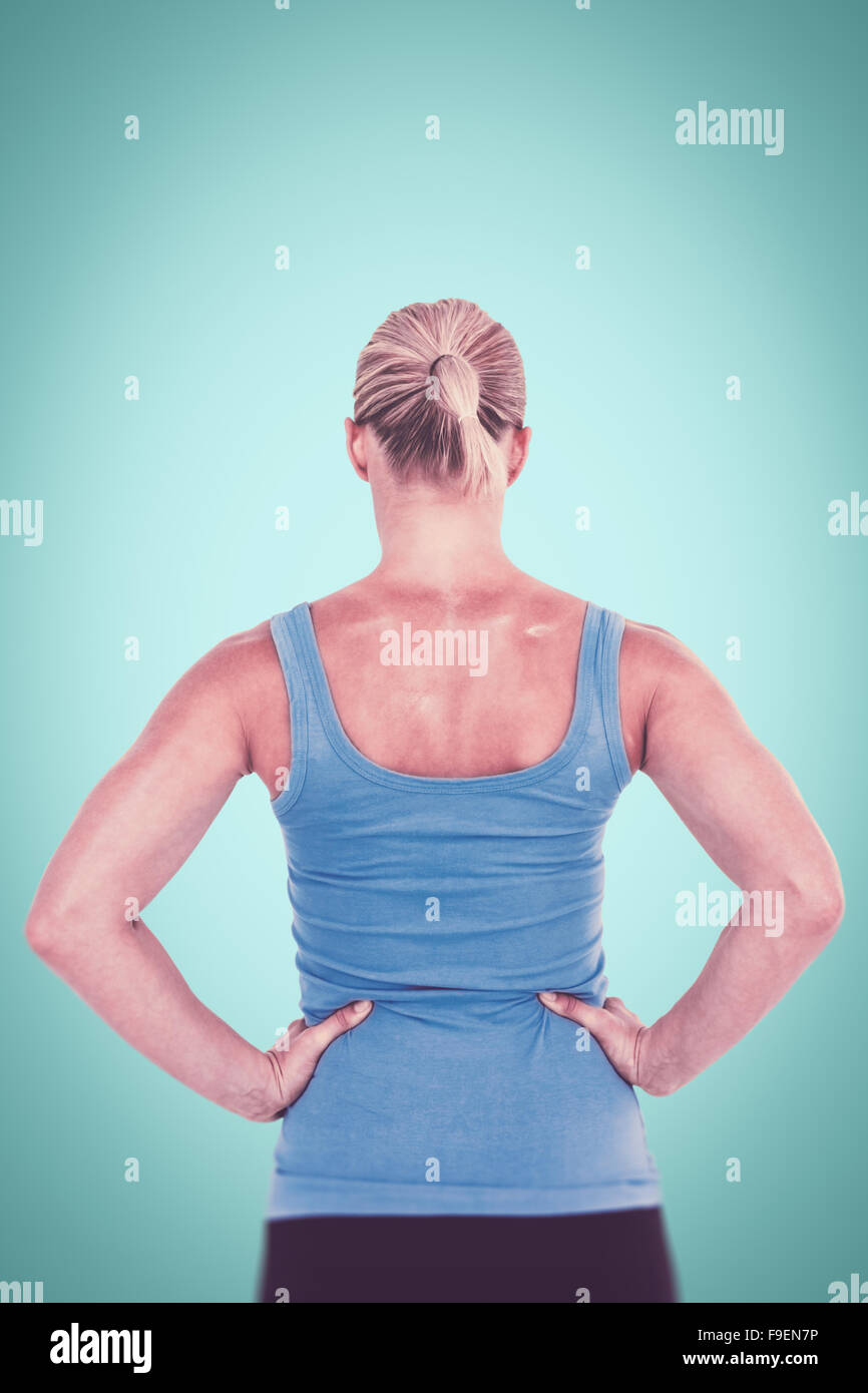 Composite image of back view of muscular woman Stock Photo - Alamy