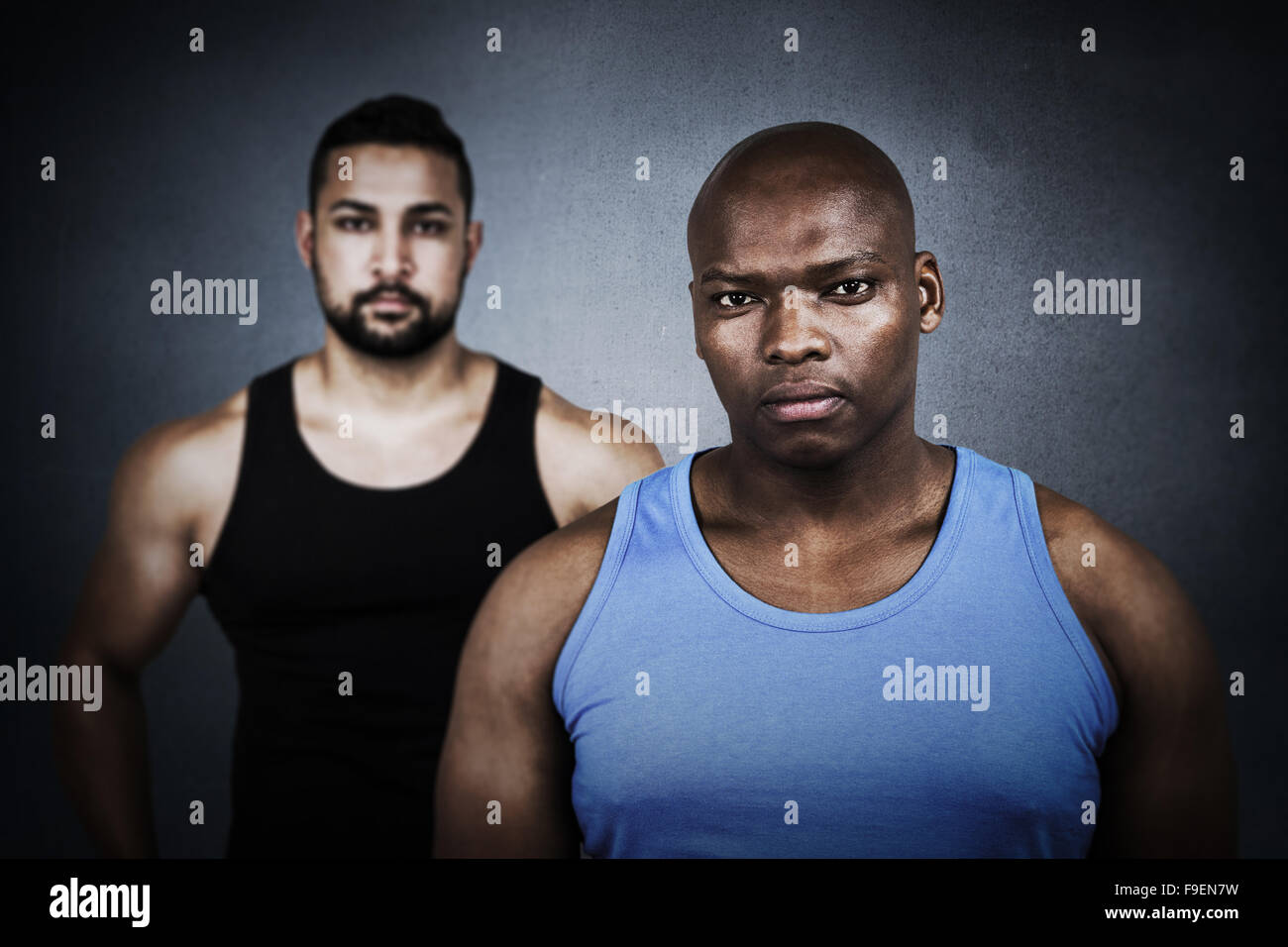Composite image of strong friends looking at camera Stock Photo - Alamy