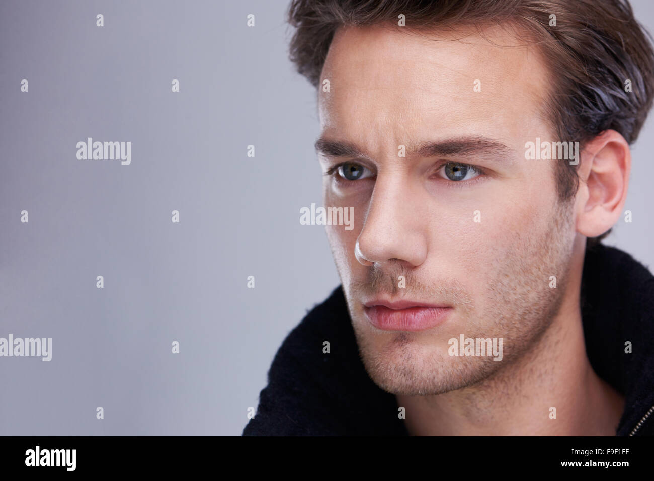 handsome young man portrait isolated on white background in studio ...