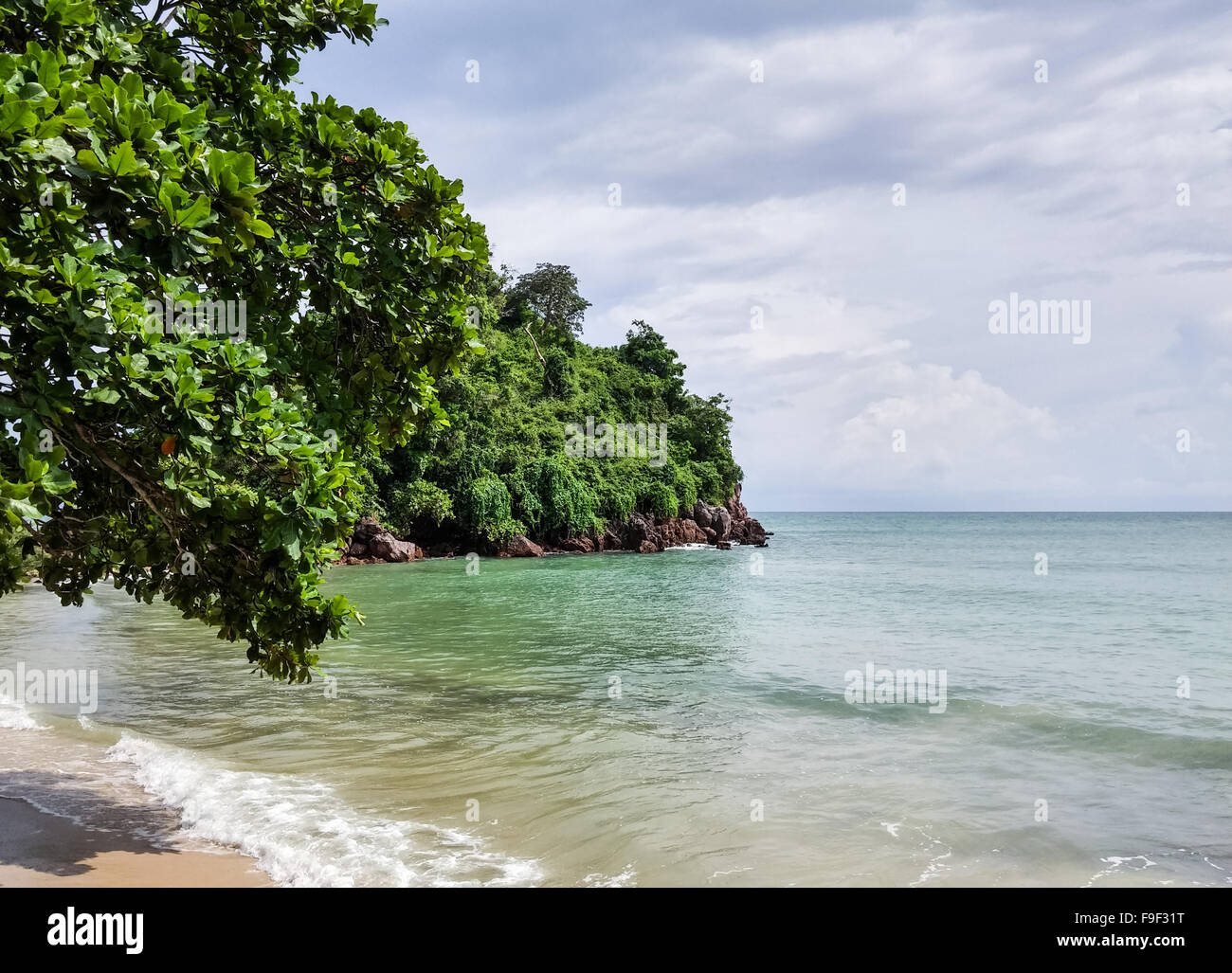 Clear sea with wave near the small cliff in Thailand Stock Photo - Alamy