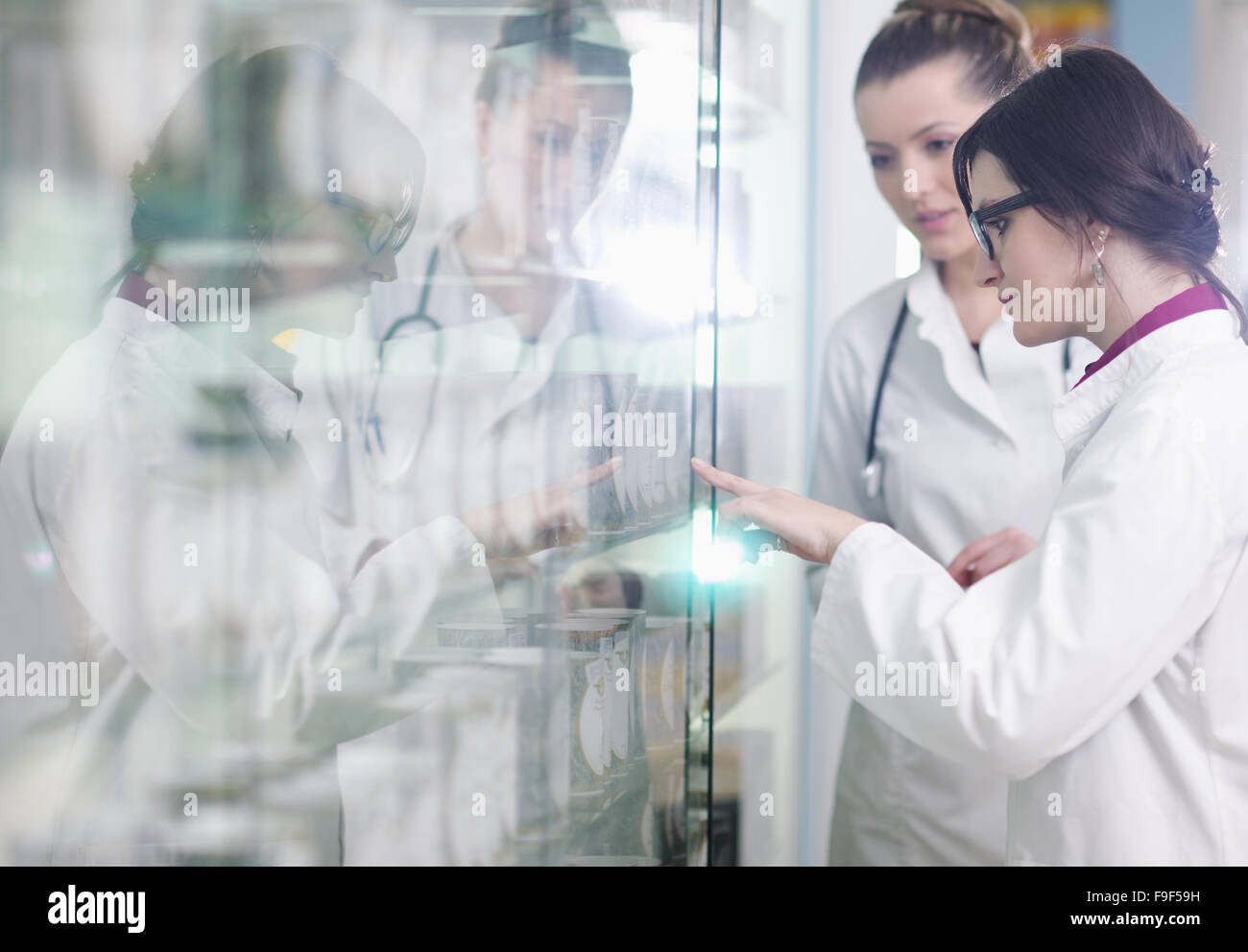 team of pharmacist chemist woman group standing in pharmacy drugstore ...