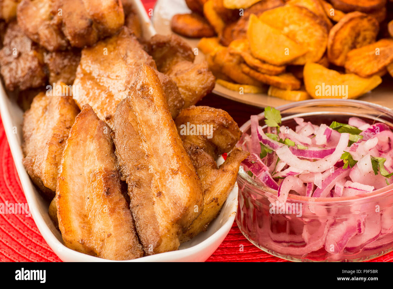 Typical Peruvian dish of Chicharron de Chancho (deep-fried prok) with ...