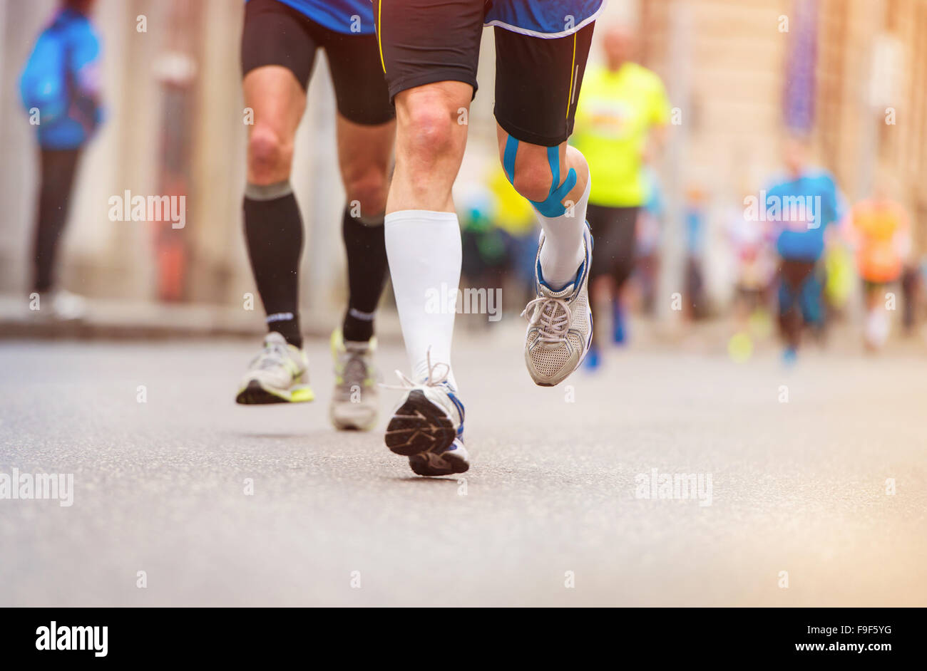 Unrecognizable young runners at the city race Stock Photo - Alamy