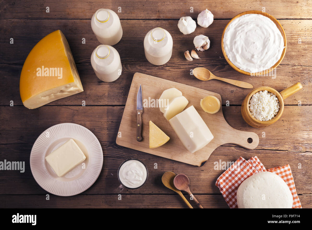 Variety of dairy products laid on a wooden table background Stock Photo ...