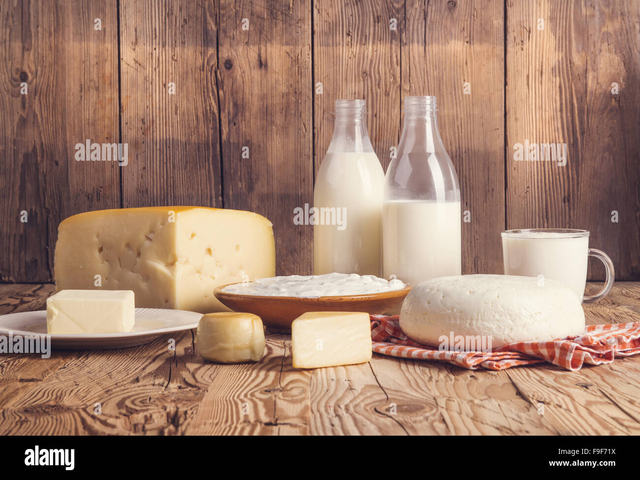 Variety of dairy products laid on a wooden table background Stock Photo ...