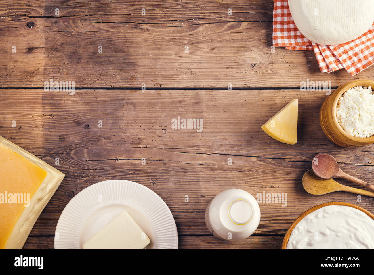 Variety of dairy products laid on a wooden table background Stock Photo ...