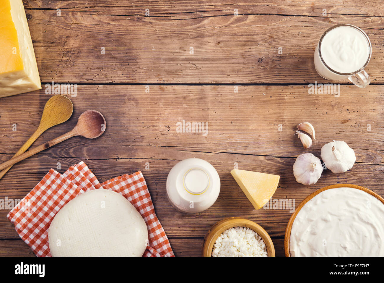 Variety of dairy products laid on a wooden table background Stock Photo ...
