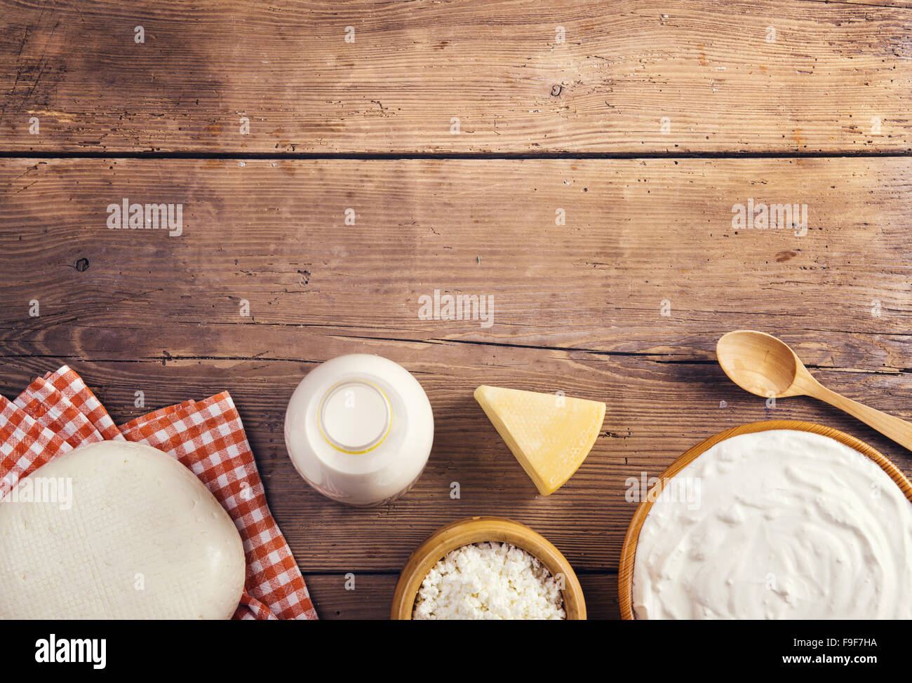 Variety of dairy products laid on a wooden table background Stock Photo ...