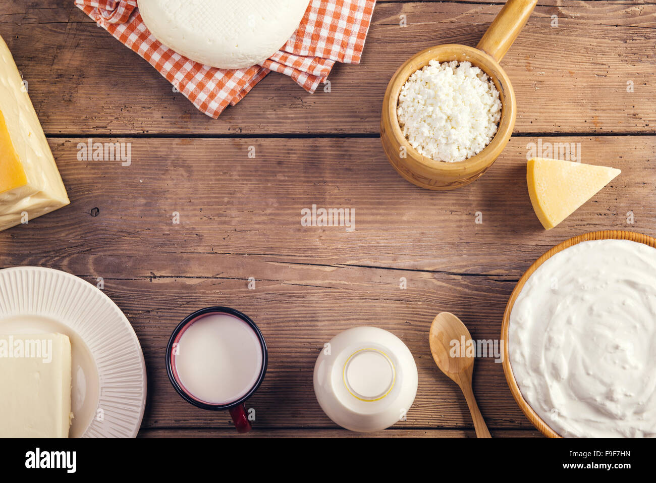 Variety of dairy products laid on a wooden table background Stock Photo ...