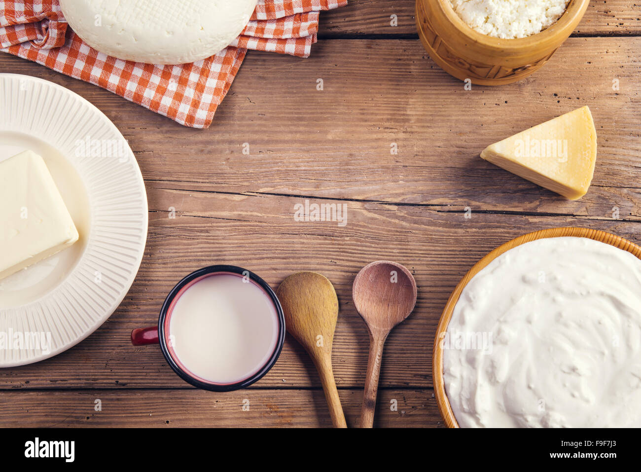 Variety of dairy products laid on a wooden table background Stock Photo ...