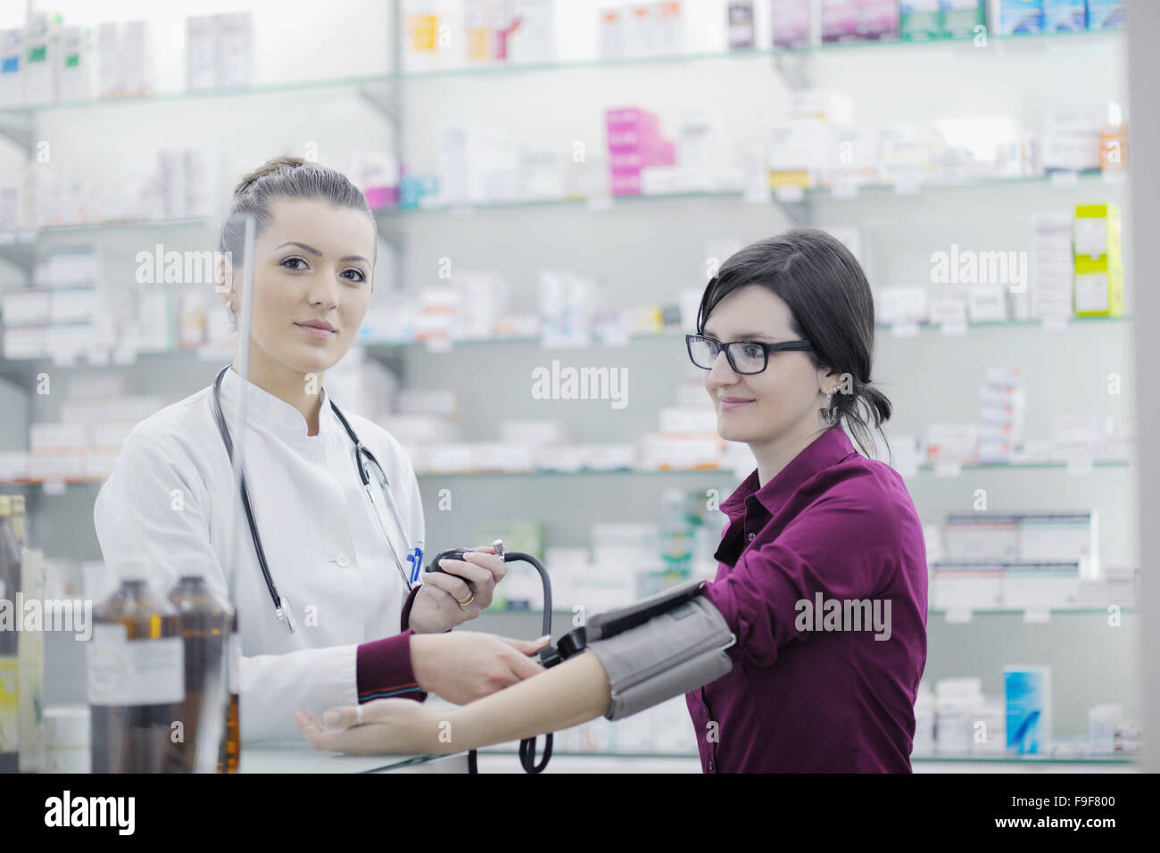 doctor checking blood pressure and heart rate in a hospital or in ...