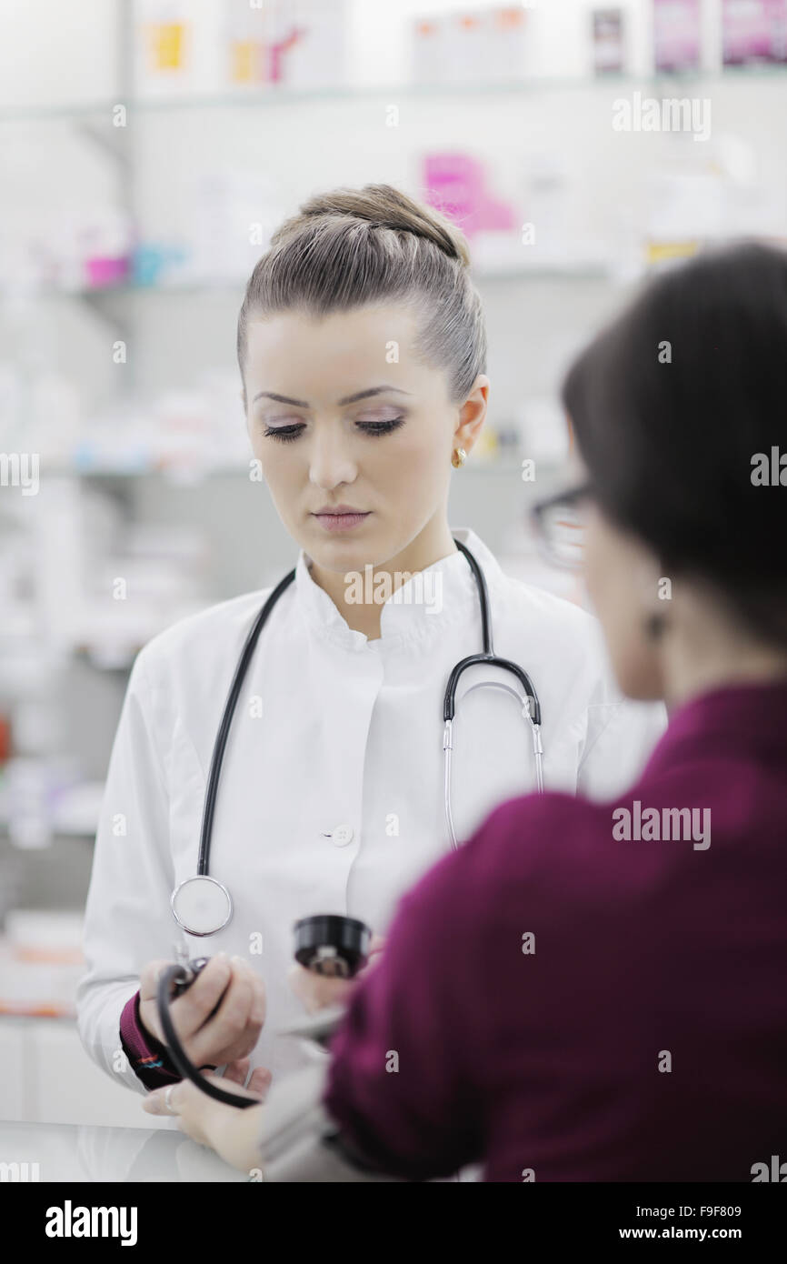 doctor checking blood pressure and heart rate in a hospital or in ...