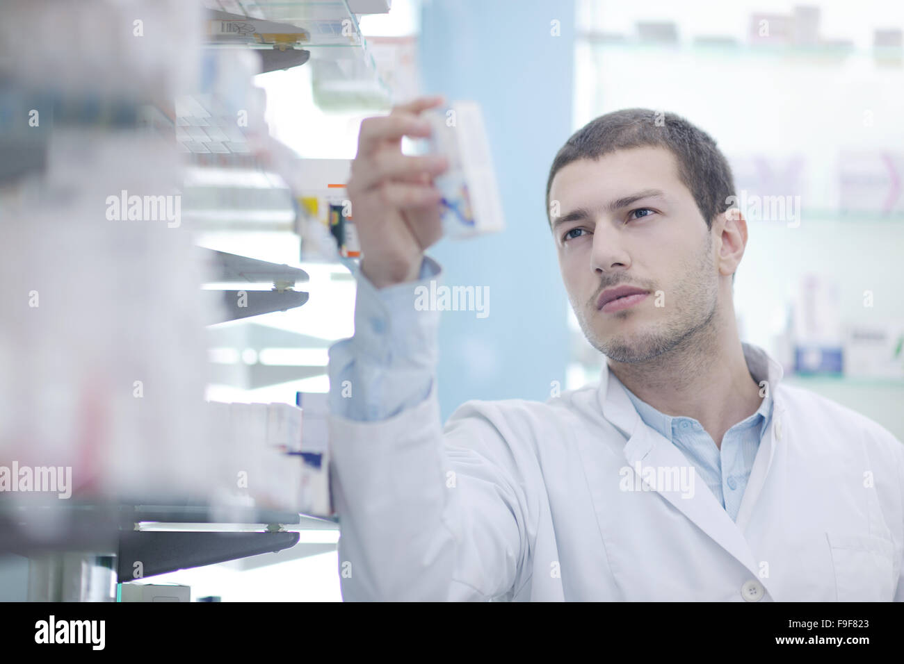 Portrait handsome young pharmacist chemist hi-res stock photography and ...