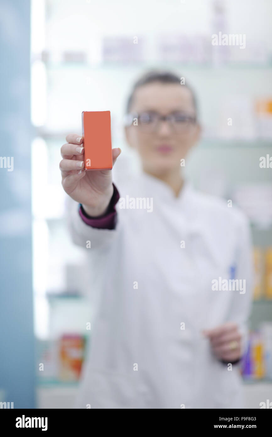 Happy cheerful pharmacist chemist woman standing in pharmacy drugstore ...