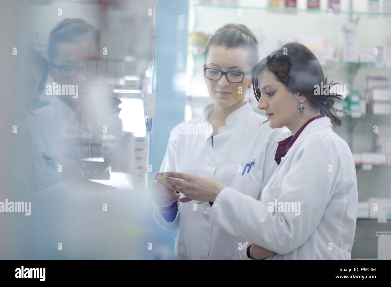 team of pharmacist chemist woman group standing in pharmacy drugstore ...