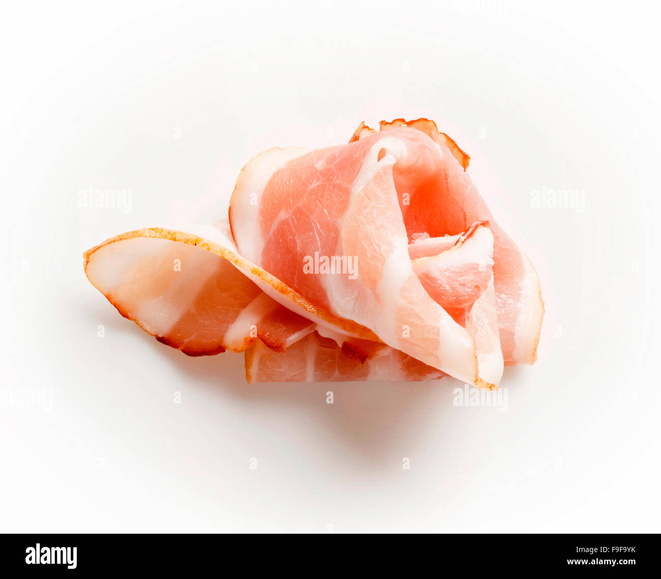 Thin slice of cured ham - studio Stock Photo - Alamy