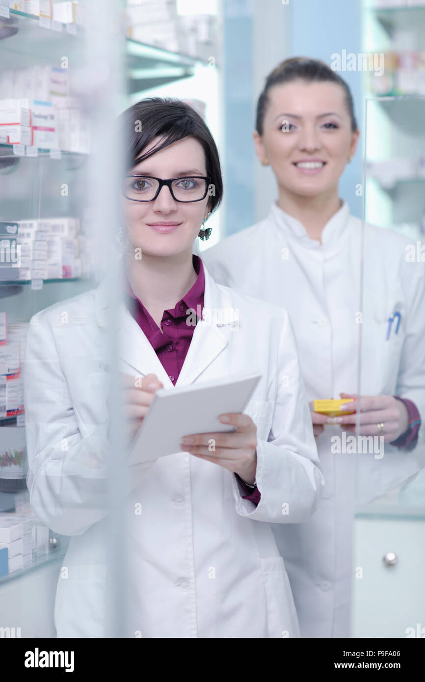 team of pharmacist chemist woman group standing in pharmacy drugstore ...