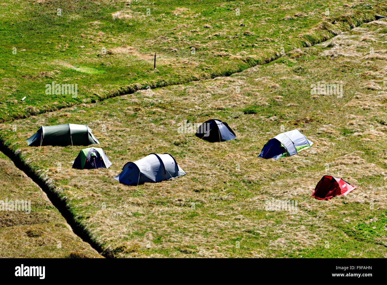 Camping tents seen from above, Hornstrandir nature reserve, Westfjords ...