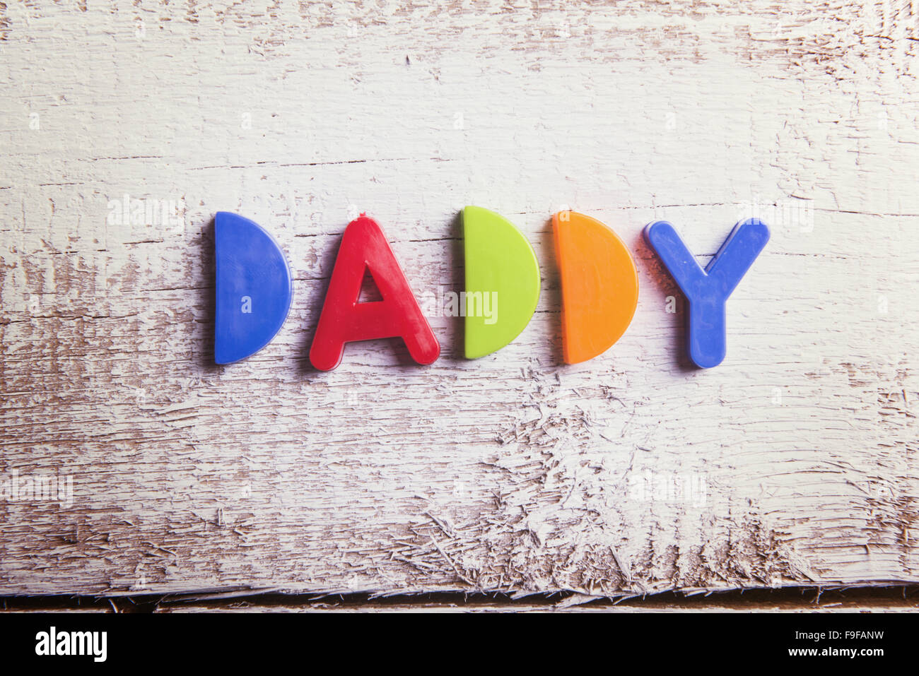 Colorful Daddy sign on a white wooden background Stock Photo - Alamy