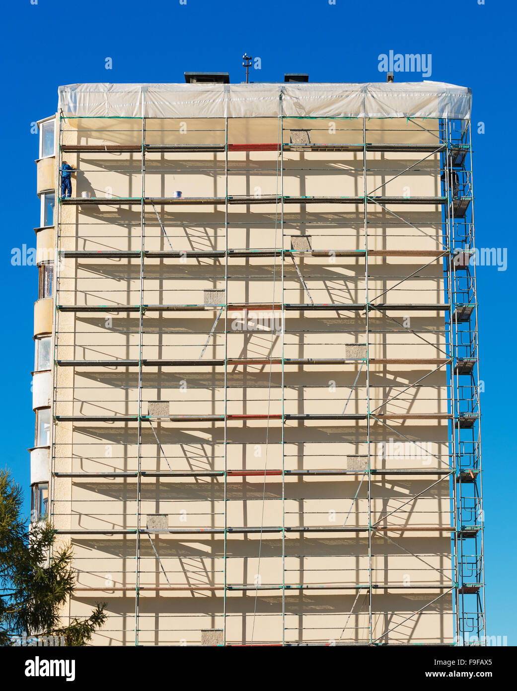 Scaffolding in front of house. Facade renovation Stock Photo - Alamy