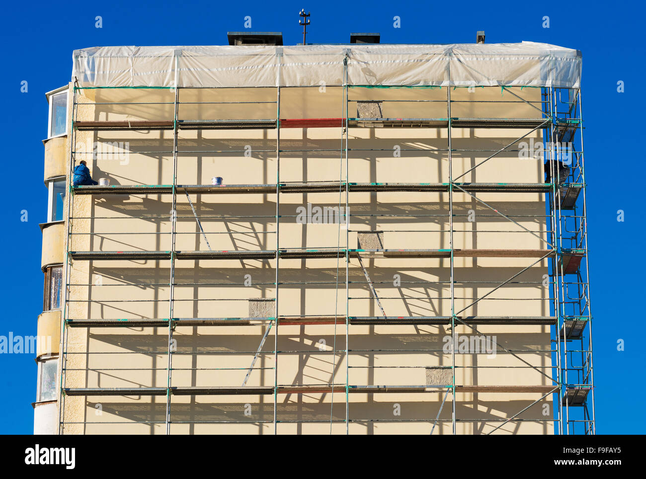 Scaffolding in front of house. Facade renovation Stock Photo - Alamy