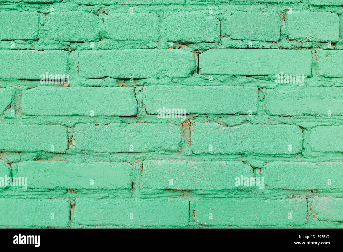 Green painted brick abstract wall background Stock Photo - Alamy