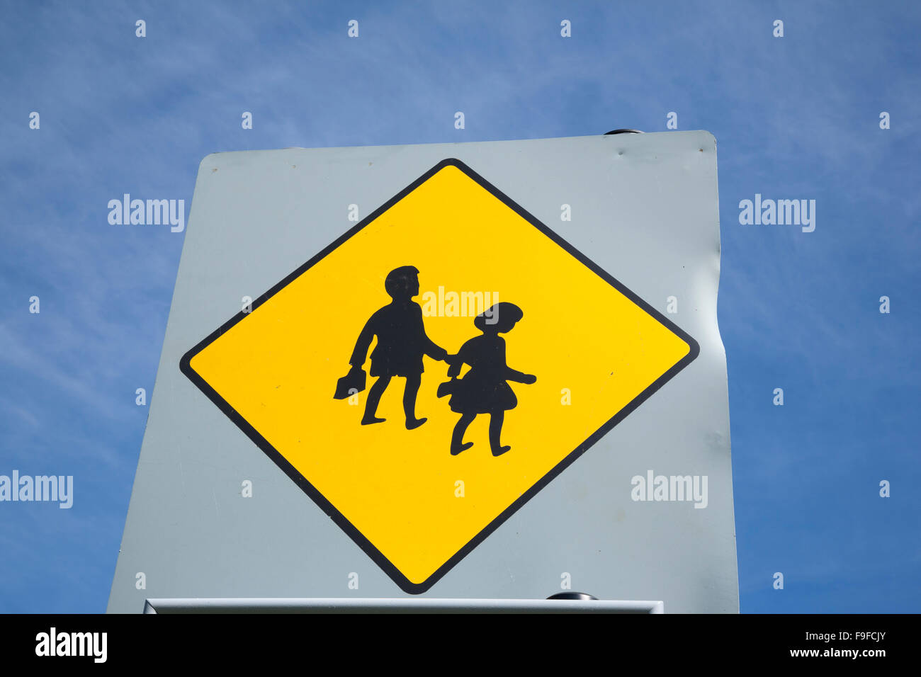 Yellow School Education Sign against Blue Sky Background Stock Photo ...
