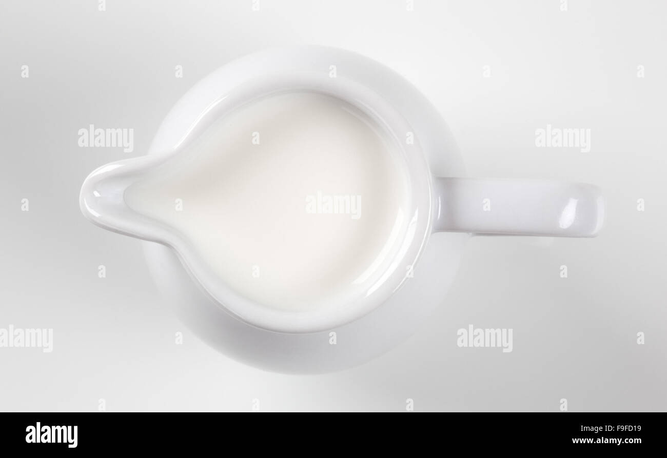 Jug of fresh milk - overhead view Stock Photo - Alamy
