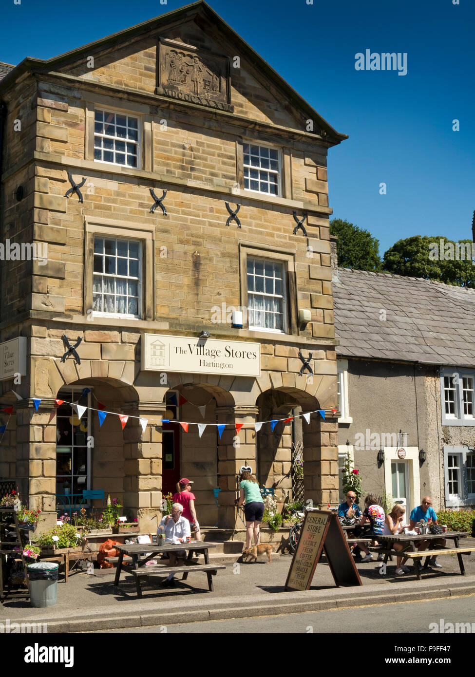 UK, England, Derbyshire, Hartington, Village Stores, customers sat at ...