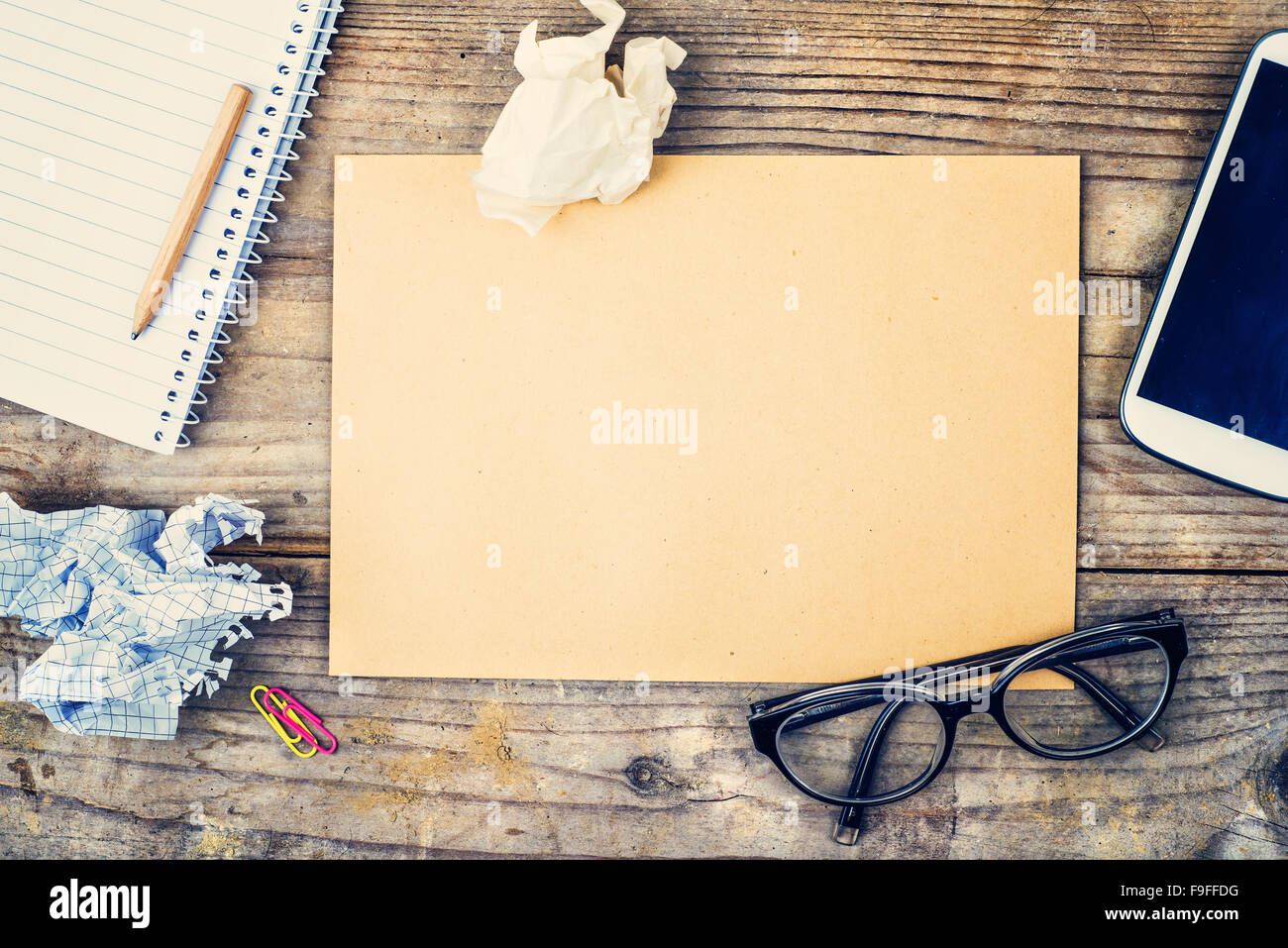Desktop mix on a wooden office table background. View from above Stock ...
